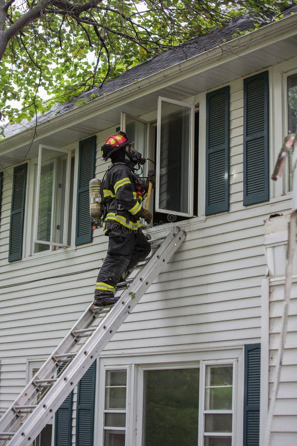 One Firefighter on Fire Scene in Front of a Building Stock Photo ...