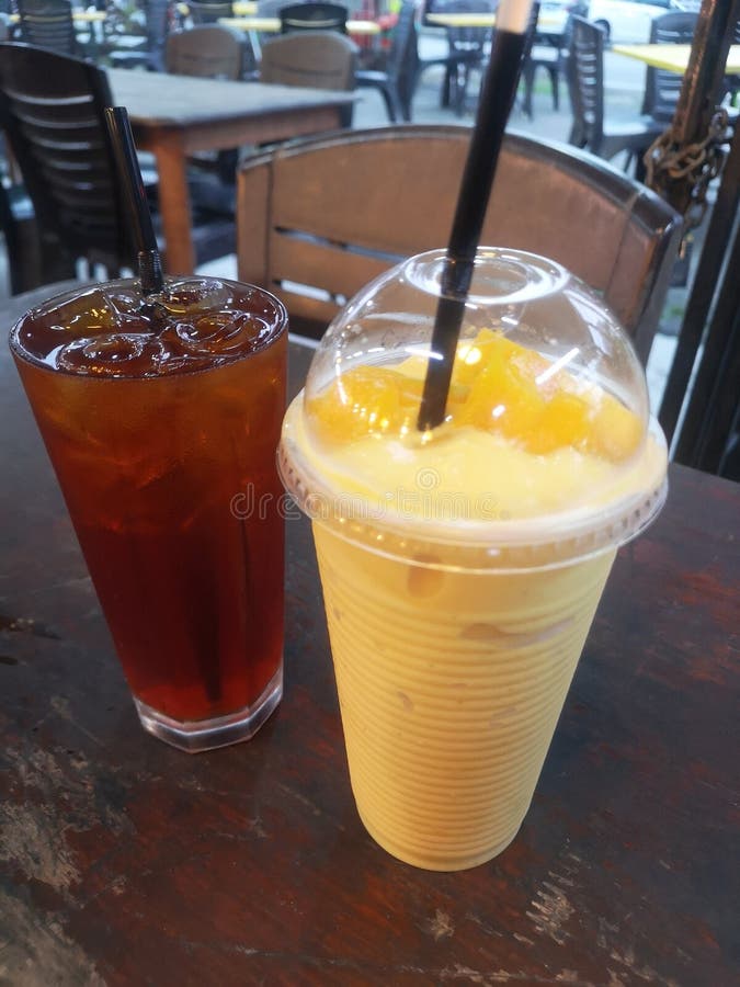 One Fresh Mango Shake and One Aromatic Tea Stock Image - Image of fresh ...