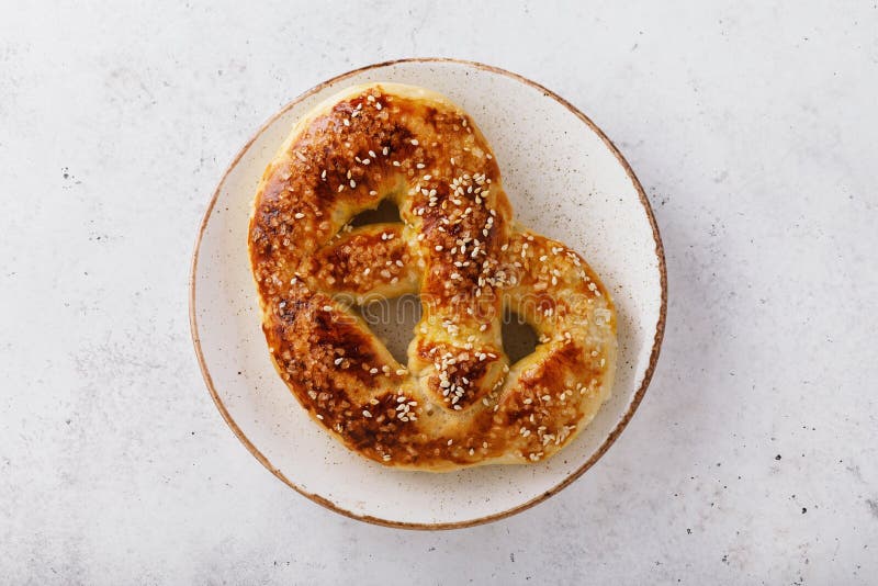 One Fresh Pretzel To Beer in a Ceramic Plate on a Table Stock Image ...