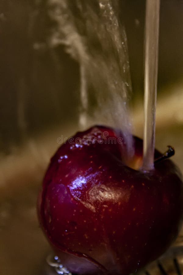 One Fresh Red Apple Under Running Water. Apple with Drops of Water ...