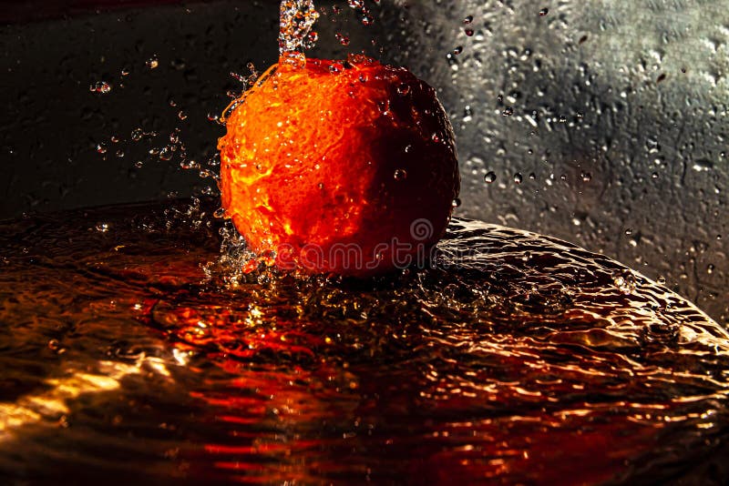 One Fresh Red Orange Under Running Water. Orange with Drops of Water ...