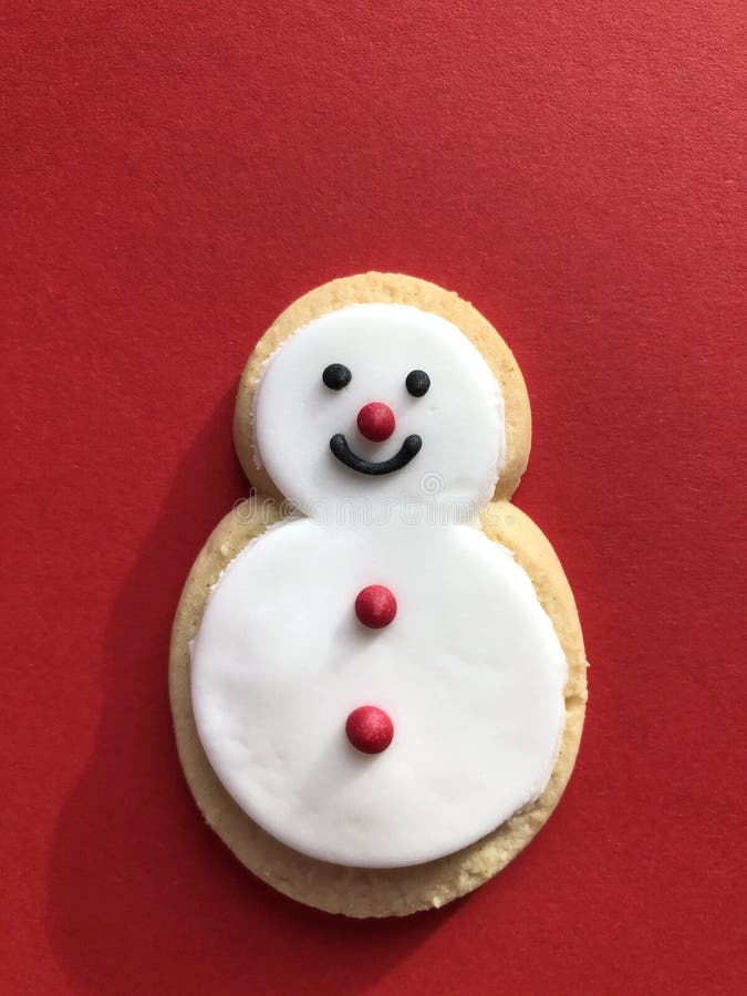Gingerbread Snowman Cookie on Red Stock Photo - Image of decoration ...