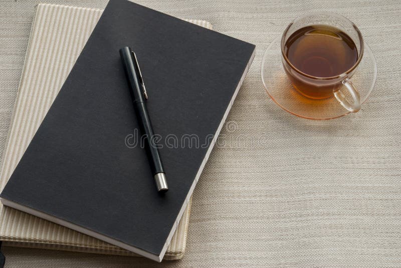 One Glass Note Book and Tea Pen Stock Image - Image of brown, view ...