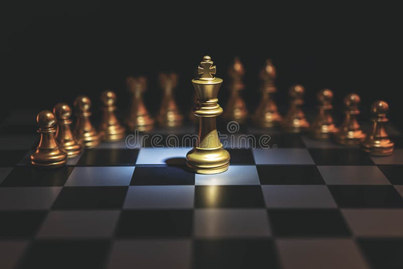 One Gold Chess Standing Against Full Set of Chess Pieces. Stock Photo ...