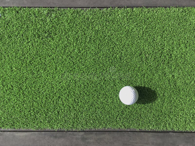 One White Golf Ball on Practice Grass Mat Under Morning Sunlight Stock ...