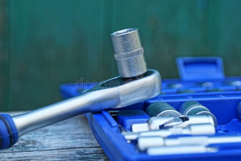 Gray Iron Key Ratchet With Socket Head On The Blue Box With Tools Stock ...