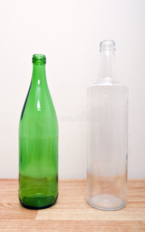 One Green Glass Bottle and One Clear Glass Bottle Stock Image - Image ...