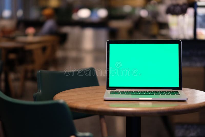 Green Screen Laptop Computer on Table in Cafe Stock Image - Image of ...