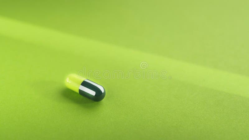 One Green and Yellow Medical Capsule Stock Image - Image of healthy ...