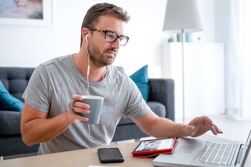 One Guy Studying at Home Sitting in Front of His Computer Stock Image ...