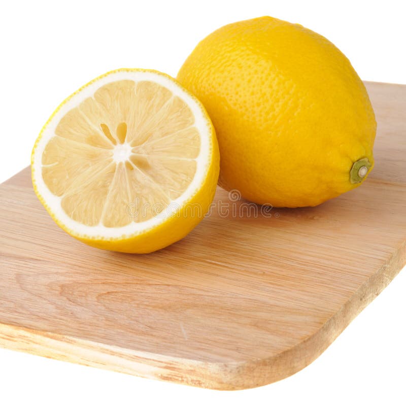 One and a Half of Lemon on Chopping Board Stock Photo - Image of ...