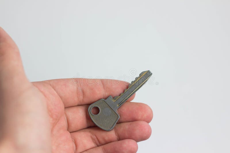 One hand and a key. stock photo. Image of mortgage, contemporary ...
