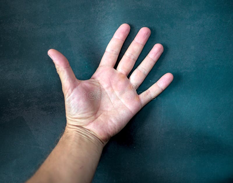 One Hand Raised with Dark Background Stock Photo - Image of positive ...