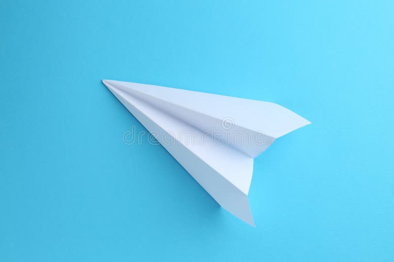 One Handmade Paper Plane on Light Blue Background, Top View Stock Image ...