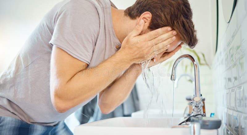 One Handsome Man Washing His Face In A Bathroom At Home Caucasian Male