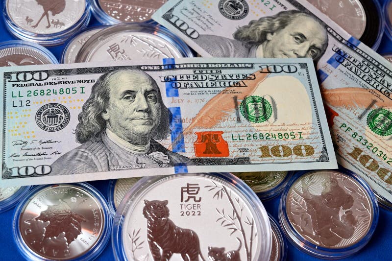 One Hundred Dollar Bills on Bunch of Silver Coins Stock Photo - Image ...