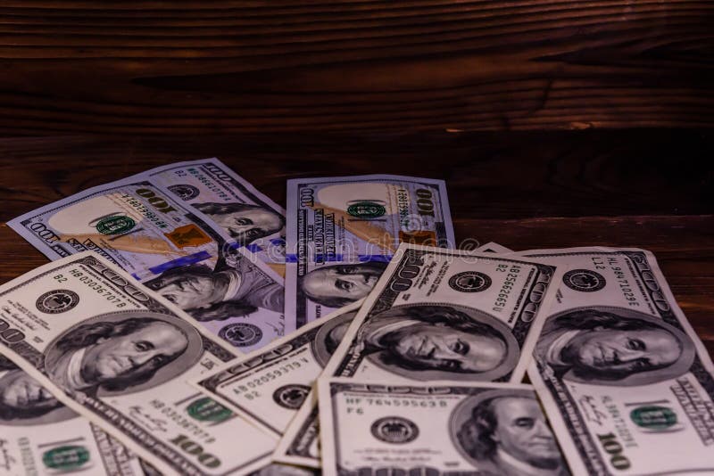 One Hundred Dollar Bills on a Wooden Table Stock Photo - Image of ...