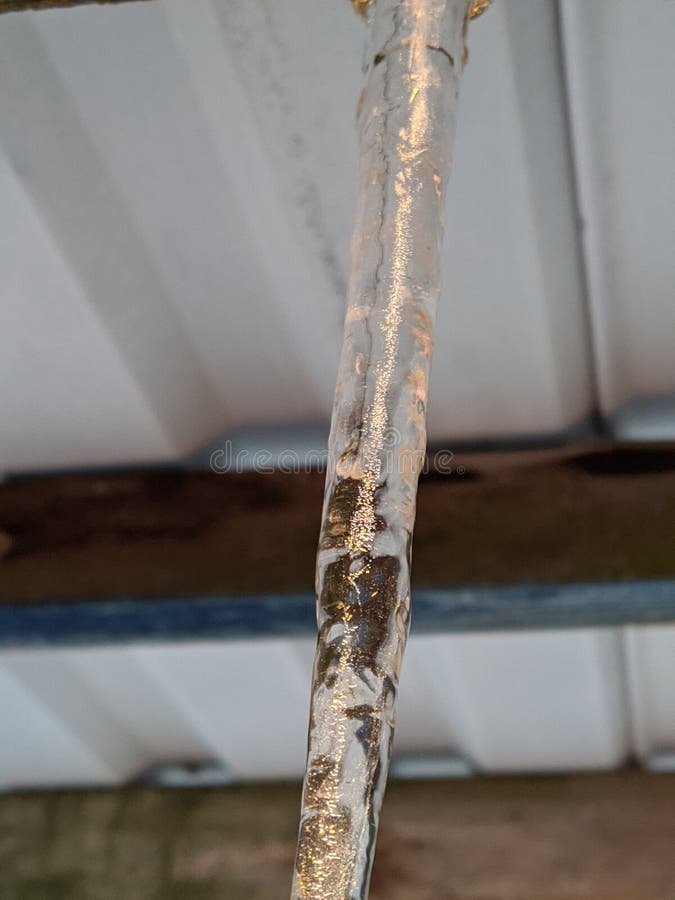 One Icicle in Which the Light and Rays of the Sun are Reflected. Stock ...