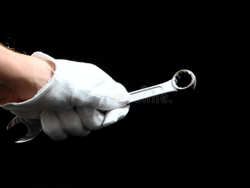 One Key bolts and a Hand stock photo. Image of work - 244854996