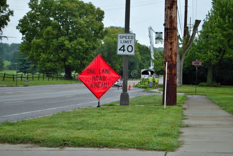 One Lane Road Ahead Construction Sign on the Side of a Five Lane Road ...