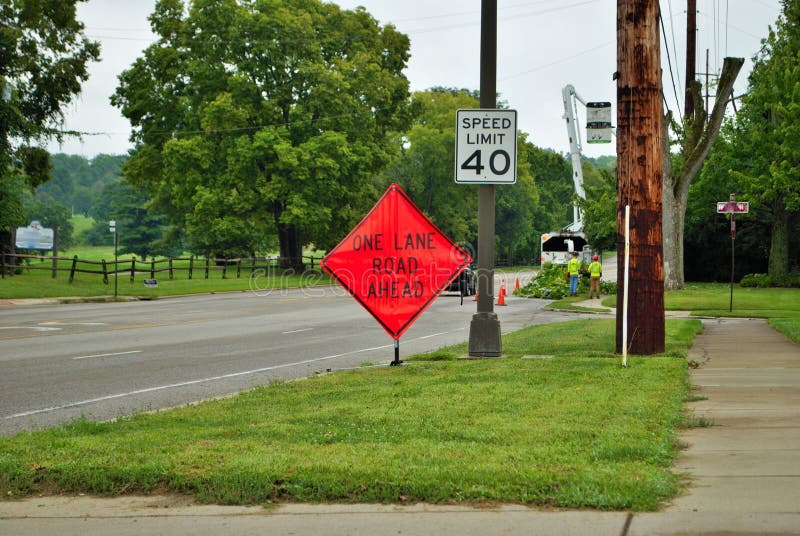 One Lane Road Ahead Construction Sign on the Side of a Five Lane Road ...