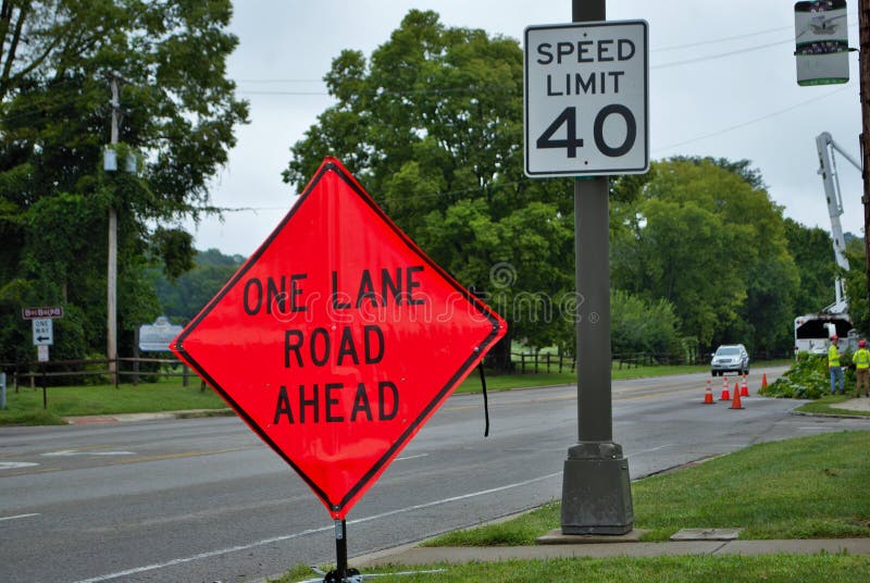 One Lane Road Ahead Construction Sign on the Side of a Five Lane Road ...
