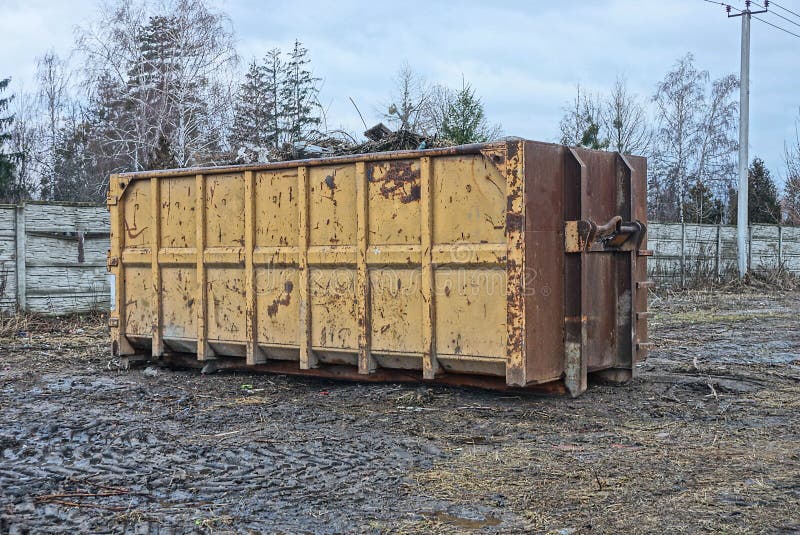One Large Brown Iron Garbage Container in Rust Stock Photo - Image of ...