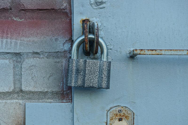 One Large Gray Padlock on an Iron Gate Stock Image - Image of large ...