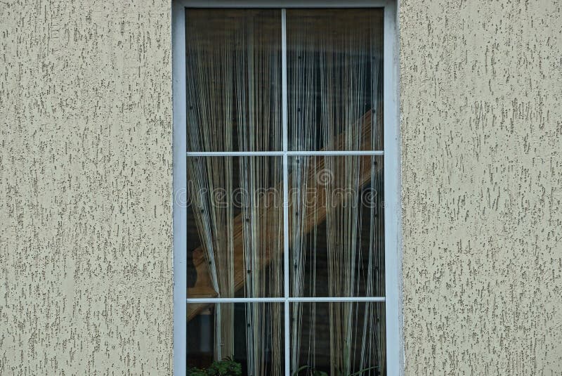 One Large Rectangular Window with a White Frame on the Gray Plastered ...