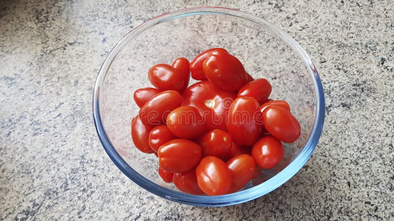 One Large Tomato at the Bottom of the Bowl is Covered with Small ...