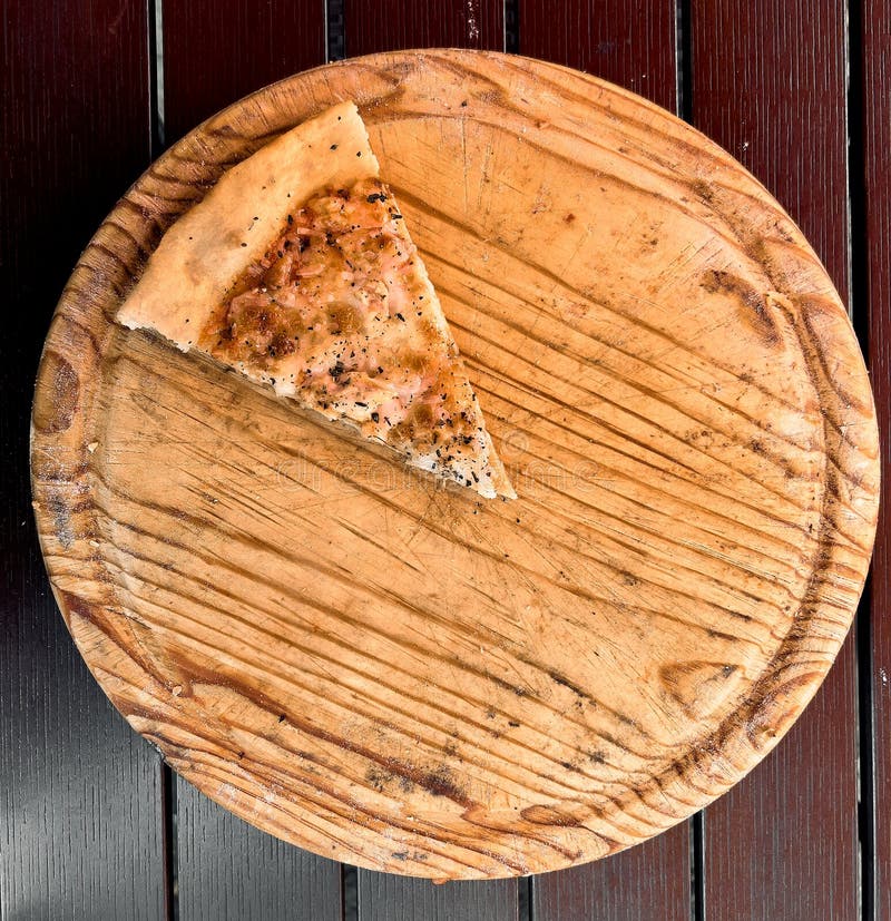 One Last Slice of Pizza on a Wooden Tray Stock Image - Image of cutting ...