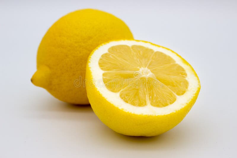 One Lemon and Half a Lemon Isolated Image on a White Background Stock ...