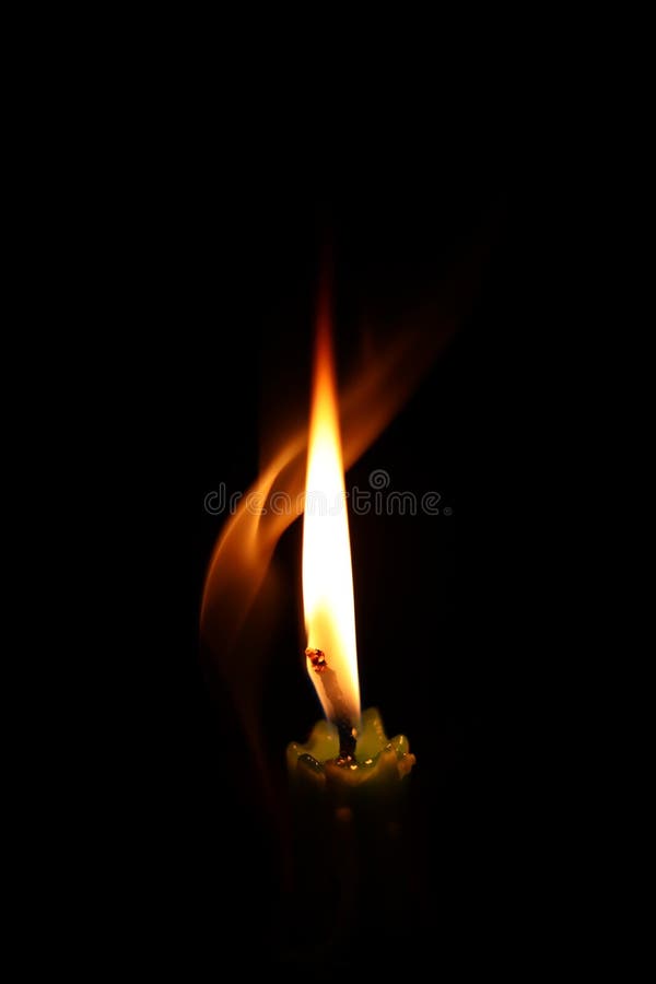 One Light Candle Burning Brightly in the Black Background. Stock Photo ...