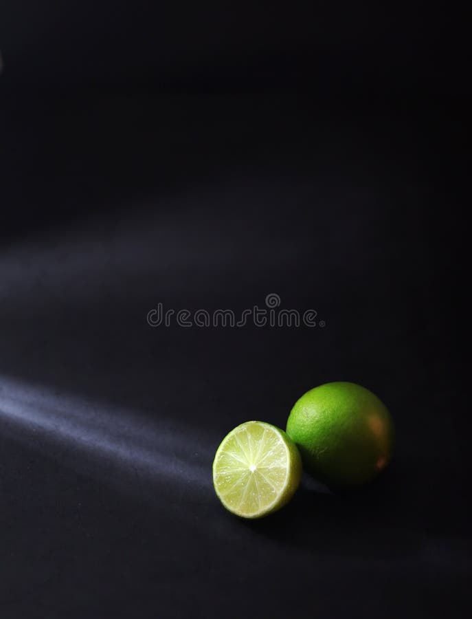 One Lime in Light Ray in Low Key Stock Photo - Image of fruit ...