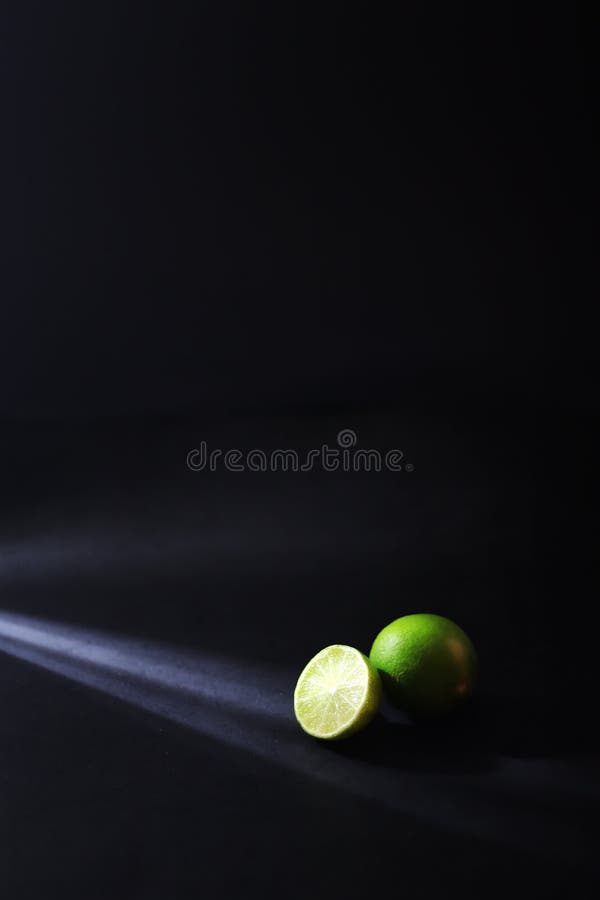 One Lime in Light Ray in Low Key Stock Photo - Image of citrus, black ...