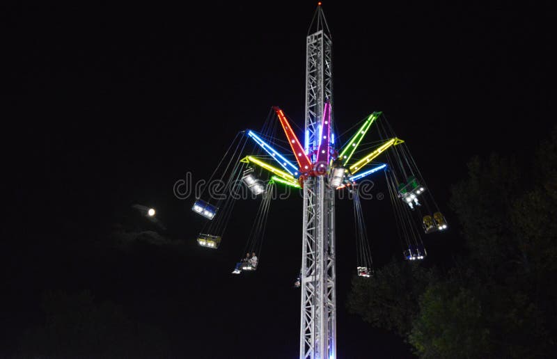 Lit slide at night stock image. Image of dark, color - 161370077