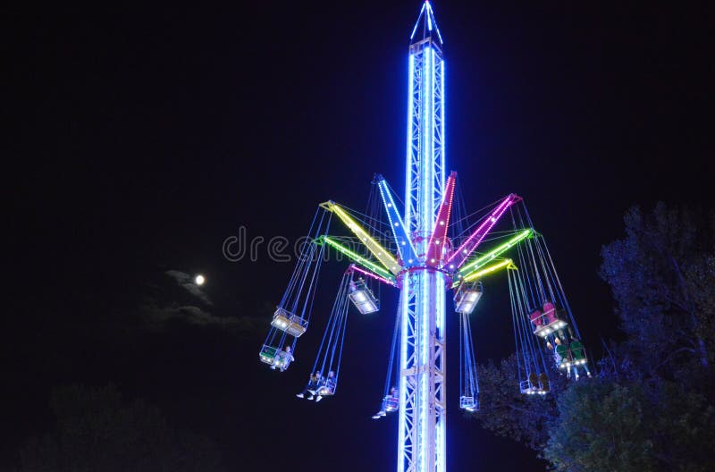 Lit slide at night stock image. Image of dark, color - 161370077