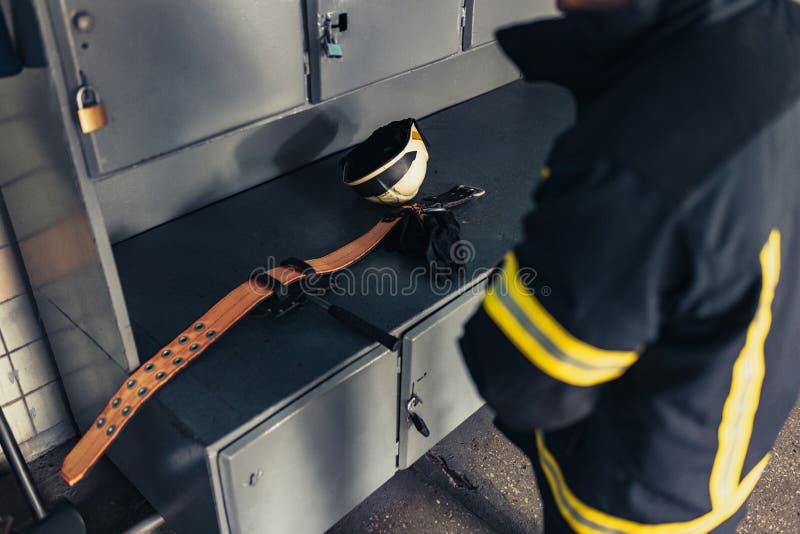 One Male Firefighter Dressed in Uniform with Protective Helmet at Fire ...