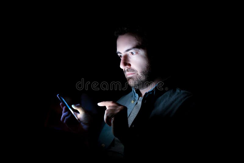 One Man Holding and Watching Cellphone at Night Stock Photo - Image of ...