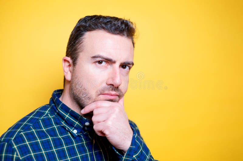 One Man Isolated on Yellow Background Feeling Puzzled and Doubtful ...