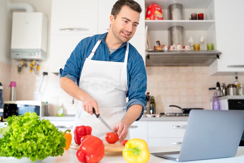 One Man is Learning To Cook Watching Video Online Stock Image - Image ...