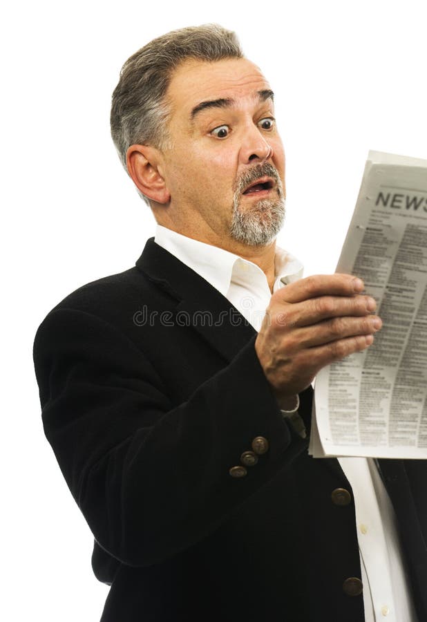 One Man Looks at Newspaper with Look of Shock Stock Photo - Image of ...