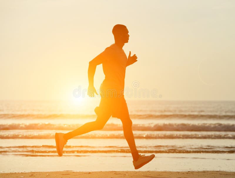 Young Man Running on Beach when Sunset Stock Image - Image of sand ...