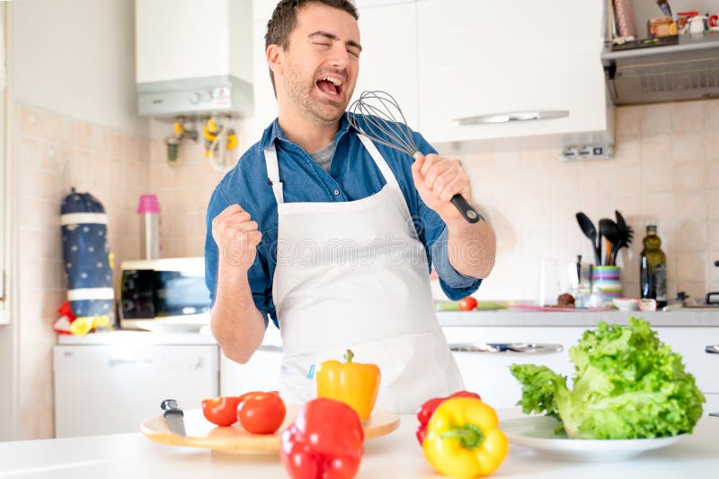 One Man is Singing in the Kitchen while Cooking Stock Image - Image of ...