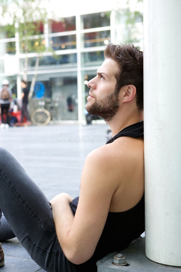 One Man Sitting Outdoors on the Floor in the City Stock Image - Image ...