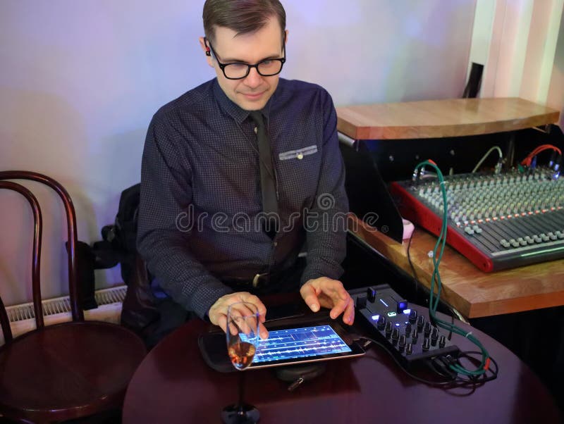 One Man is Sitting with a Tablet and Mixing Stock Image - Image of ...