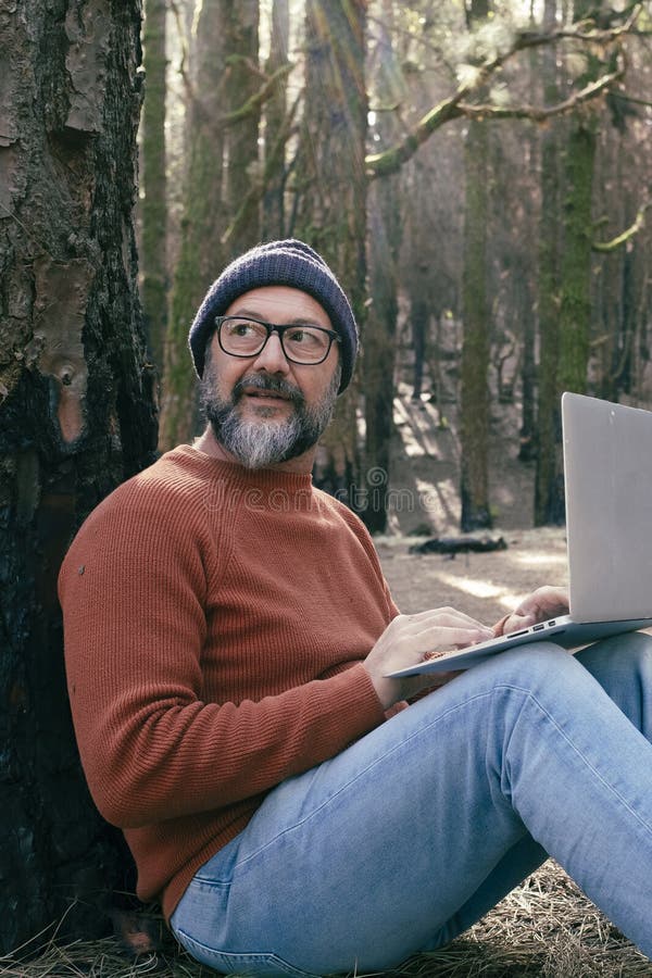 One Man Using Phone Cellular Connection in a Forest Wood Enjoying ...