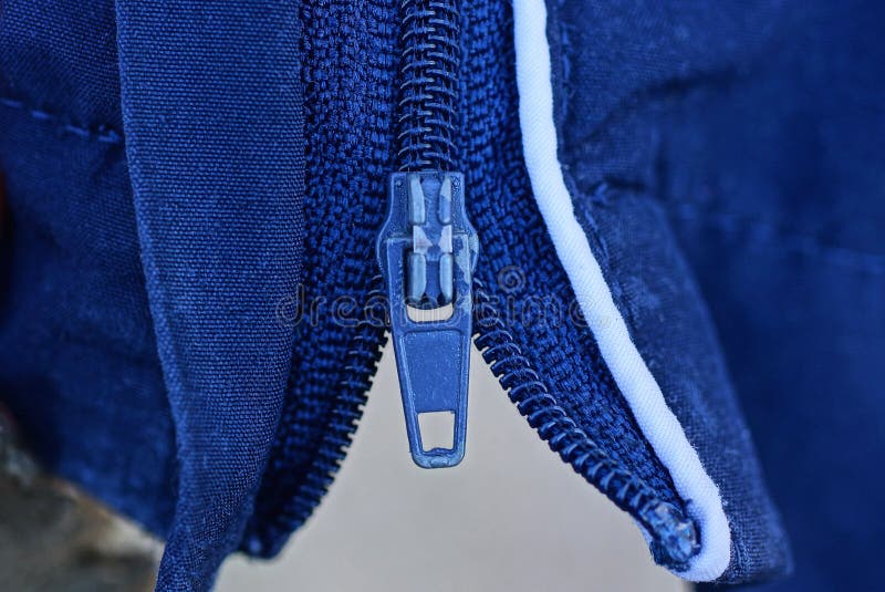 One Metal Zip on a Piece of Blue Matter Stock Image - Image of clothes ...