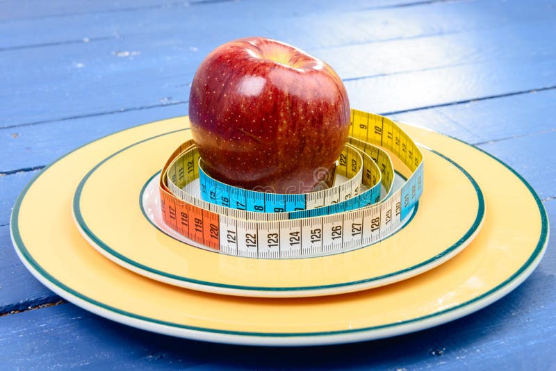 One Meter Ribbon Around Apple in the Plate Stock Image - Image of lose ...