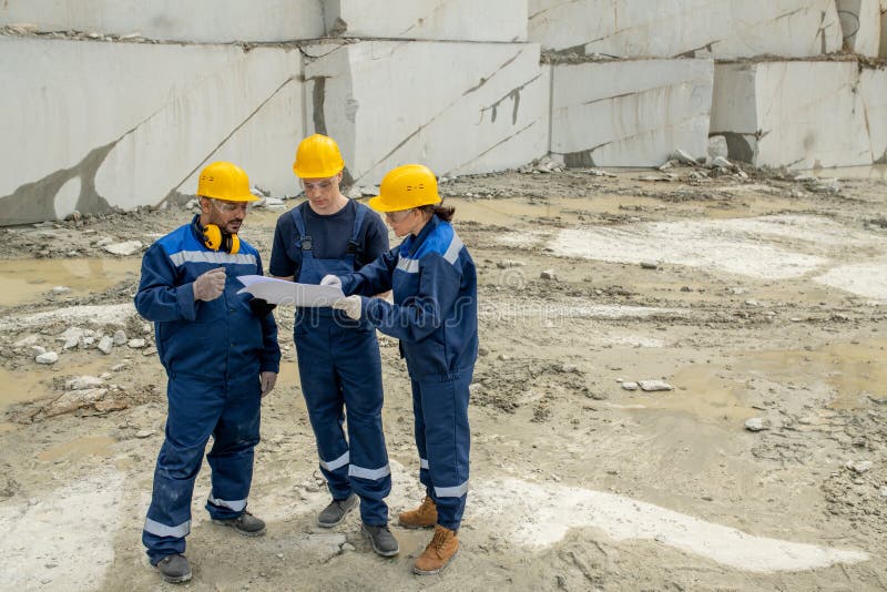 One of Modern Builders Pointing at Sketch of Construction Stock Image ...